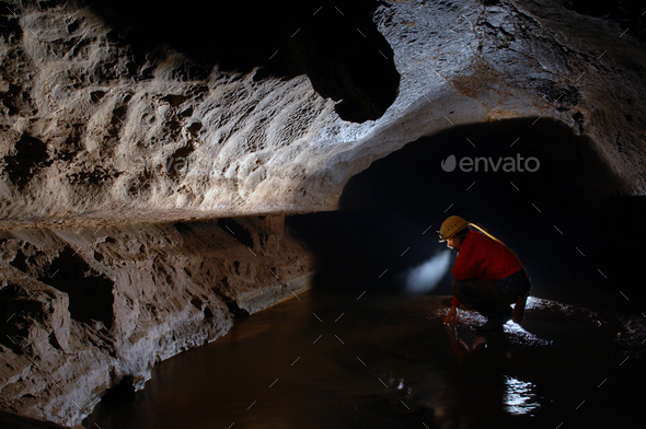 Cave Explorer, Spelunker, Archeologist Studying Underground Passage in ...