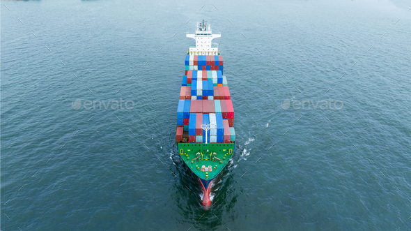 Aerial front view of cargo container ship carrying container box running for export concept ...