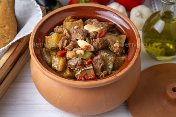 Top view of Turkish dish Guvech - baked meat with eggplant etli ...