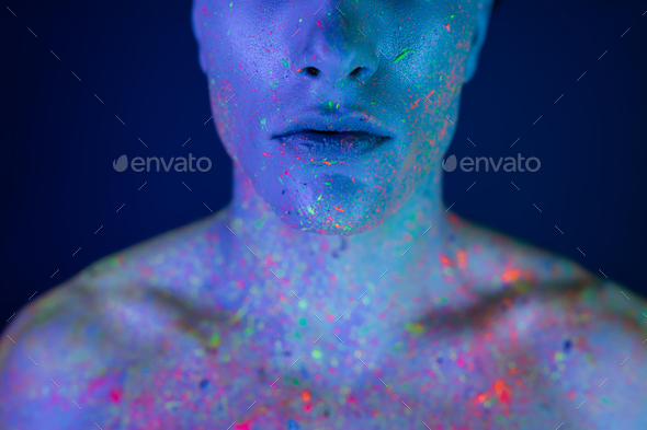 partial view of young and shirtless man in multicolored and vibrant ...