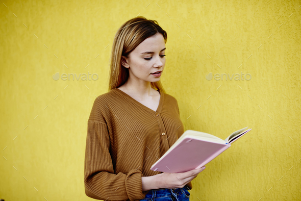 Concentrated woman reading notes in diary Stock Photo by GaudiLab ...