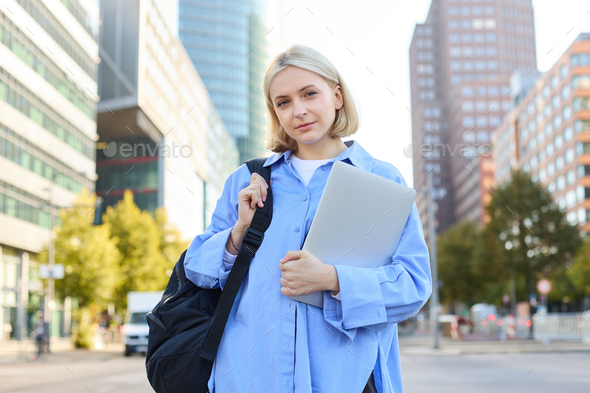 Portrait of young confident woman, college student with backpack and ...