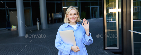 Friendly smiling student, blond girl with notebooks, tutor waving hand ...