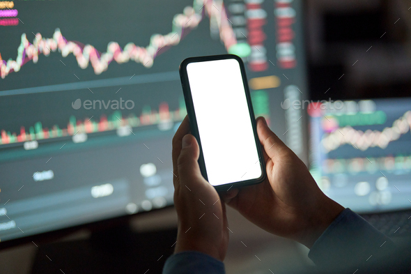 Trader holding phone mobile white mock up screen on stock trading ...