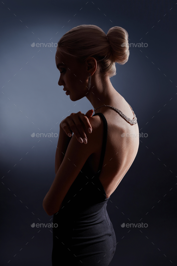 Fashion woman portrait on dark background, the silhouette woman with ...