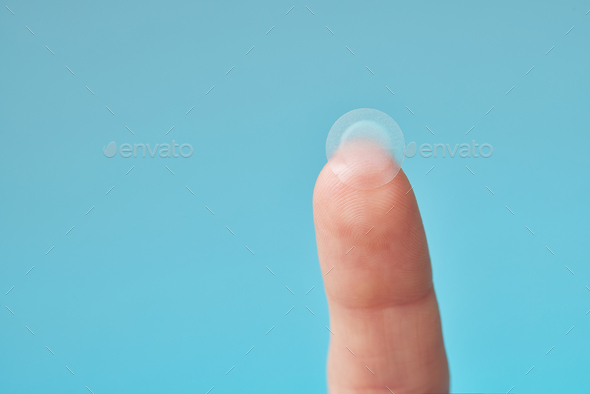 Girl with acne stick round acne patch on her cheek. Facial rejuvenation ...