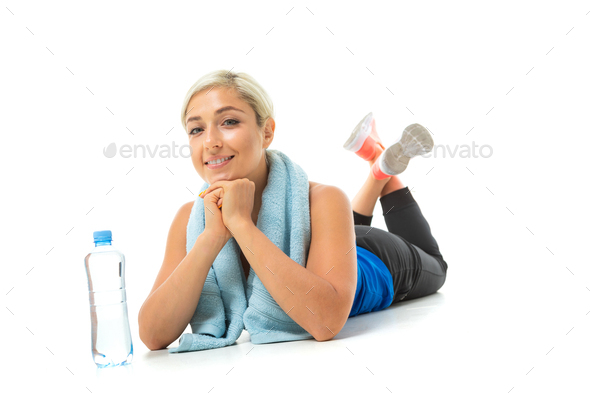 Sport caucasian woman relax with towel and water after hard workout ...
