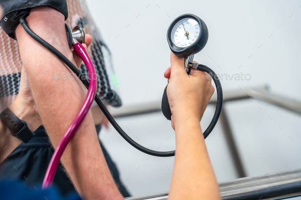 Cardiologist with a tool to measure the blood pressure Stock Photo by ...