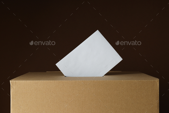 Paper ballot box with paper on black background Stock Photo by ...