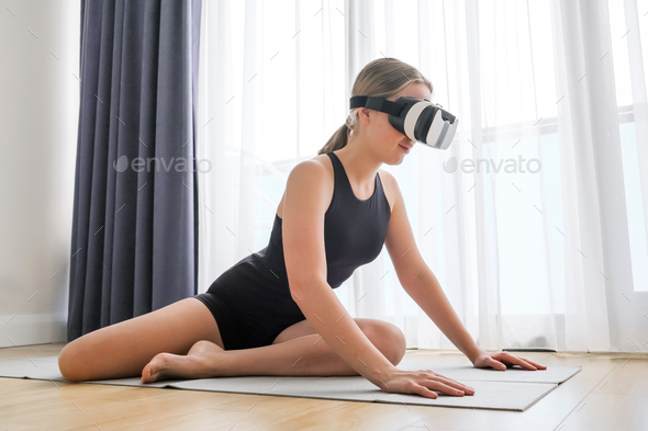 VR fit.Girl doing fitness in VR glasses at home,virtual reality ...