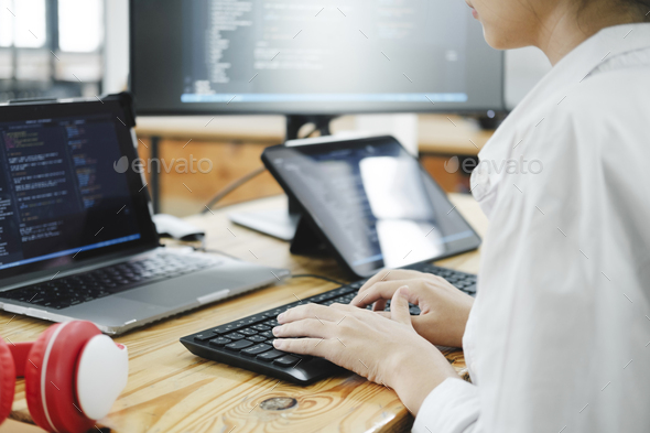 IT Programmer Starts Working on Desktop Computer. Stock Photo by ijeab