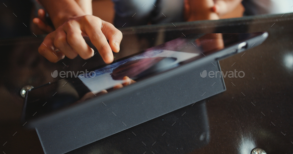 Closeup of the child's hand touching the screen of the tablet. Stock ...