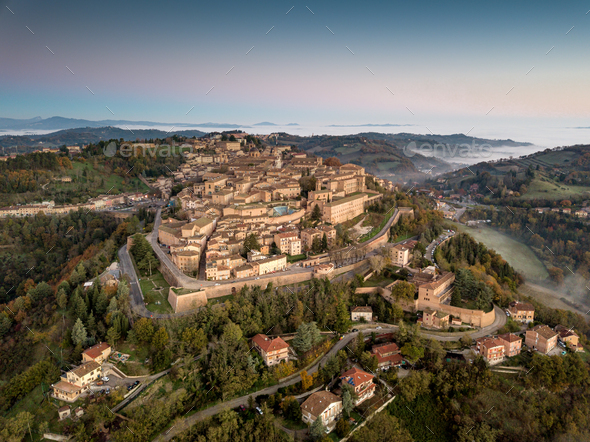 Aerial view of the medieval walled city on a mountain during the day ...