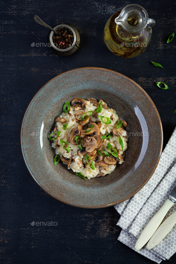 Italian cuisine - risotto with mushrooms. Cooked arborio rice with ...