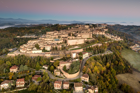 Aerial view of the medieval walled city on a mountain during the day ...
