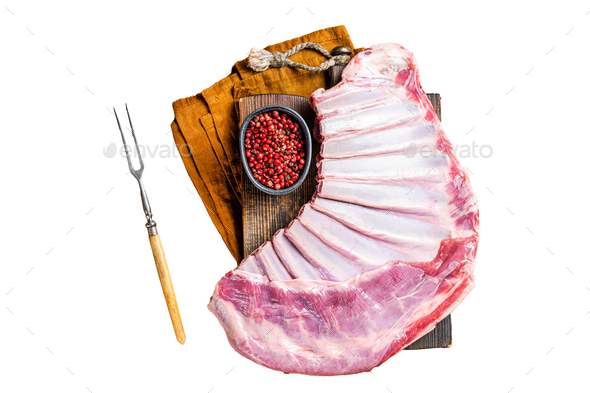 Raw rack of lamb mutton ribs on butcher board with spices. Isolated ...