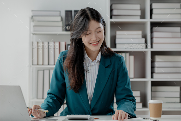 Accountant calculating numbers on calculator, Auditor is working on ...