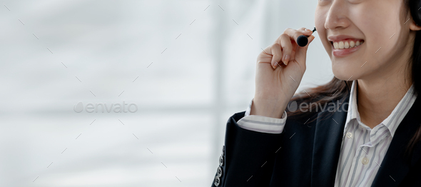 Call center employee talking with customer through headset, The ...