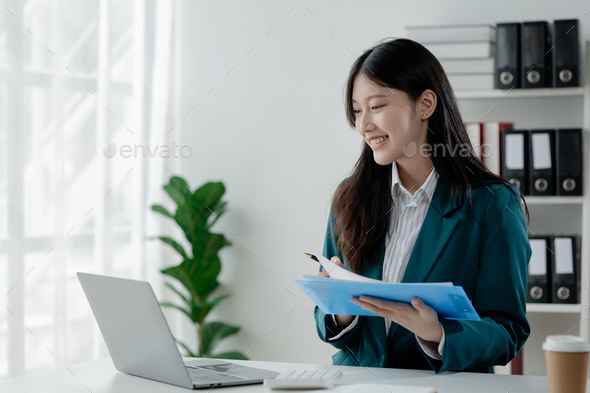 Accountant calculating numbers on calculator, Auditor is working on ...