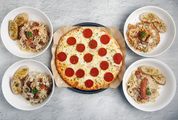 Freshly cooked Pizza with assorted toppings Stock Photo by junpinzon