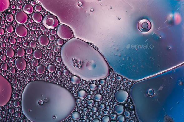 abstract liquid background with iridescent colors Stock Photo by andreiuc88