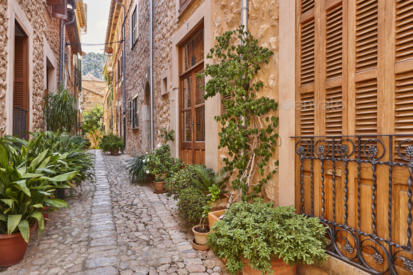 Traditional stone alley decorated with plants in Mallorca, Spain Stock ...
