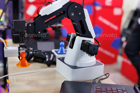 Close up view of moving futuristic robotic clamp arm at robot ...