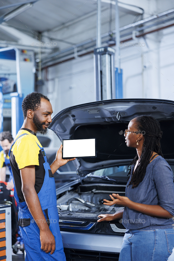 Vehicle mechanic holds mockup device Stock Photo by DC_Studio | PhotoDune
