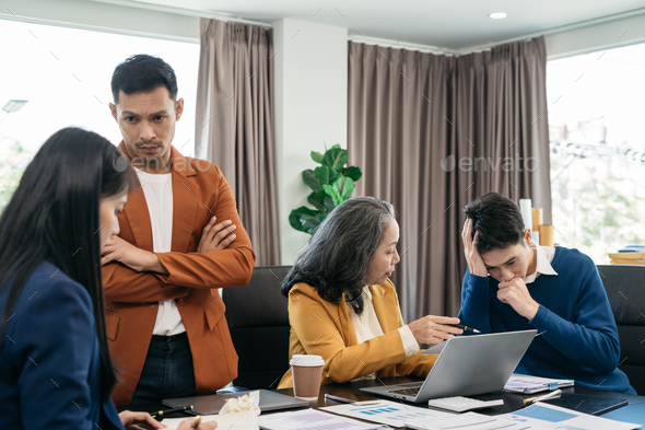business team sitting sad and solving problems in the office. Failed ...