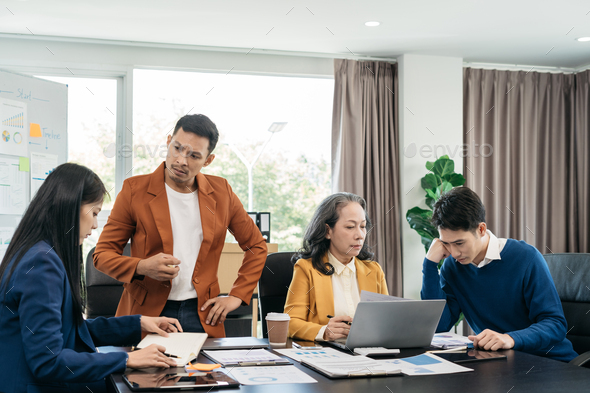 business team sitting sad and solving problems in the office. Failed ...