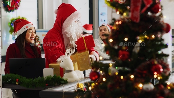 Employee dressed as Santa in office Stock Photo by DC_Studio | PhotoDune