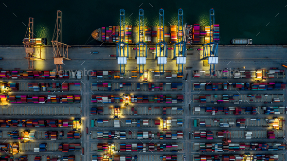 Aerial view container cargo ship industrial port working at night ...