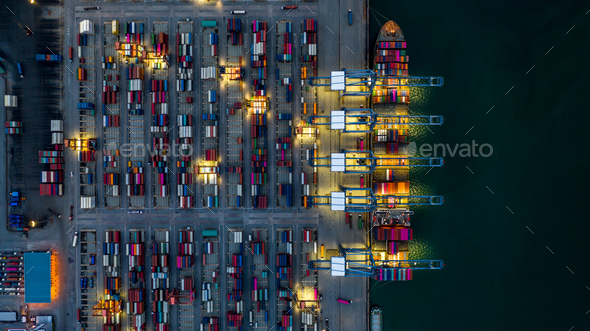 Aerial view container cargo ship industrial port working at night ...