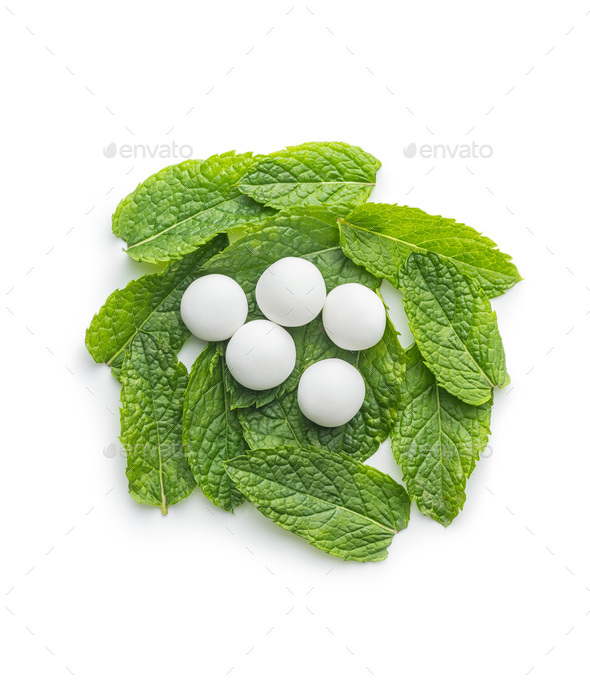 Mint candies. Menthol bonbons and mint leaves isolated on white ...