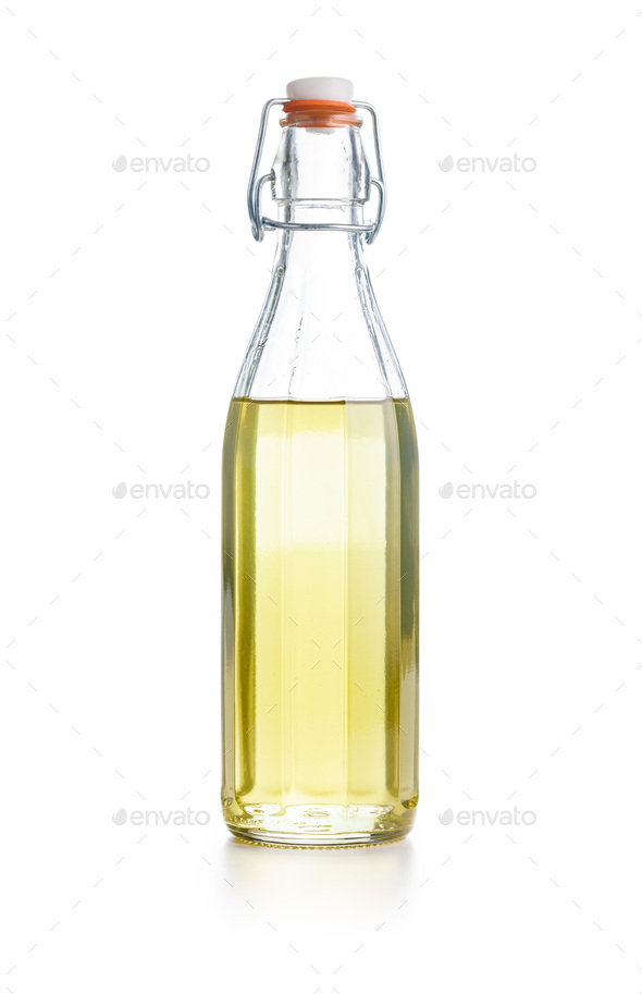 Olive oil or sweet syrup in glass bottle isolated on white background ...