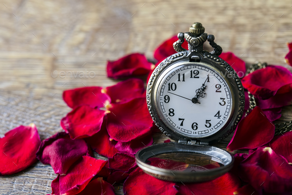 Red Rose and pocket watch, time, background Stock Photo by esindeniz