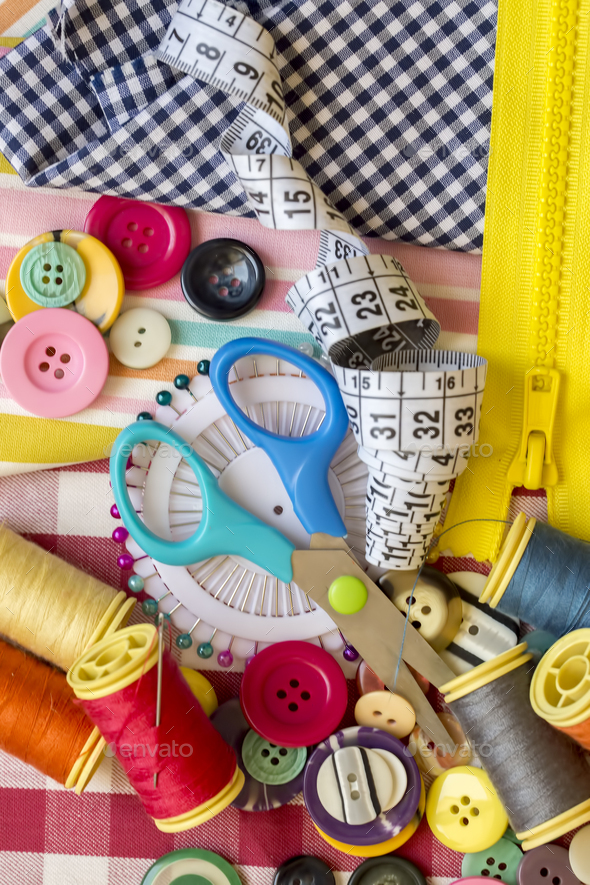 Tailor materials; colored spool rope and buttons Stock Photo by esindeniz