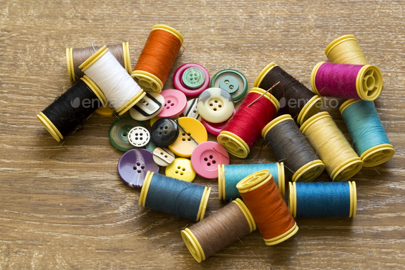 Tailor materials; colored spool rope and buttons Stock Photo by esindeniz
