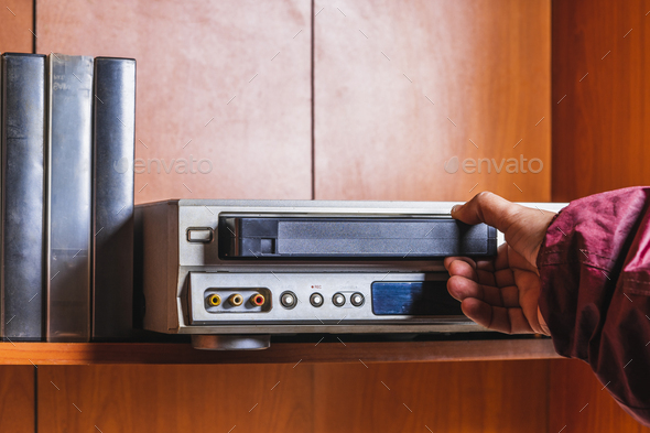 retro vhs tape player, wearing a jacket in the style of the 90s, Stock ...