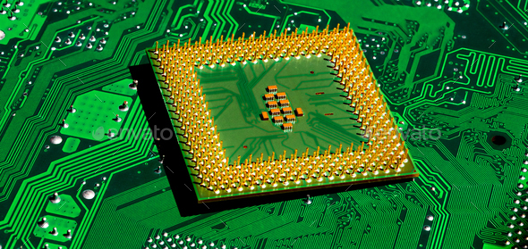 Close up of microchips and pins on Main CPU PC processor circuit board ...