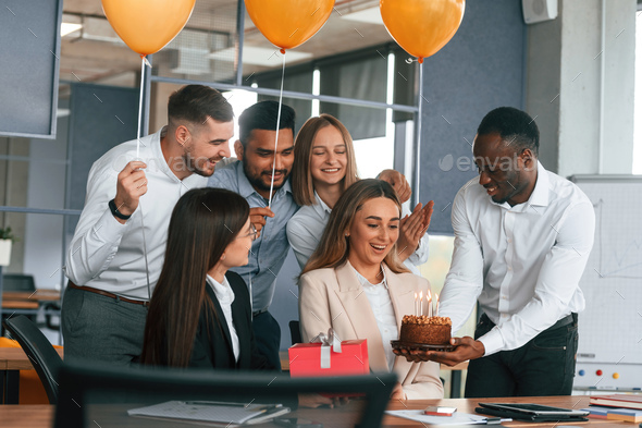 Celebration with cake. Employee having a birthday in the office, group ...