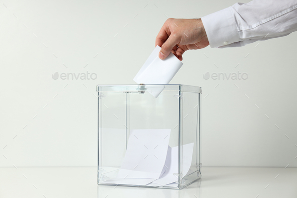 Voting box with papers and male hand on white background Stock Photo by ...