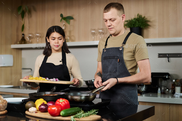 Man and Woman Cooking Food on Stove Stock Photo by AnnaStills | PhotoDune