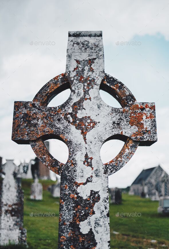 Close-up vertical shot of a cross in the cemetery -memorial cross with ...