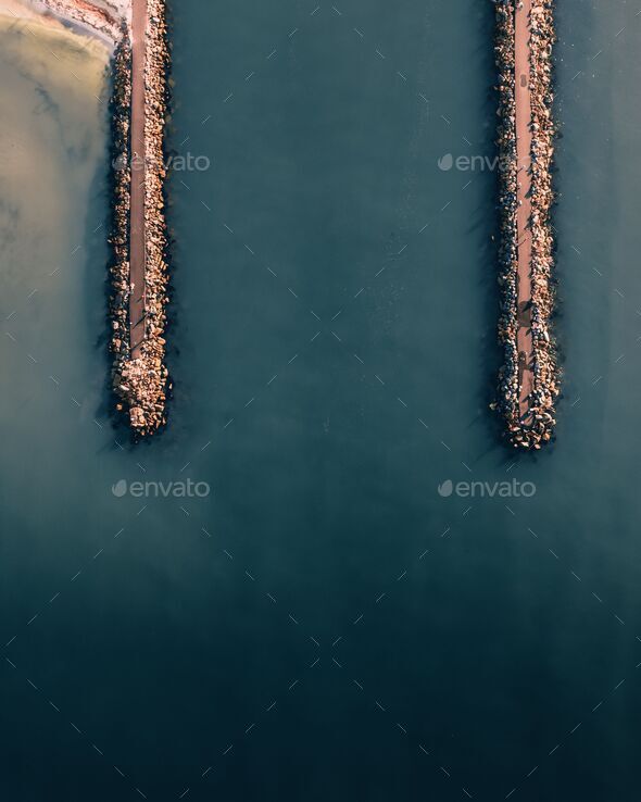 Vertical aerial top view of rocky pathways in the ocean Stock Photo by ...