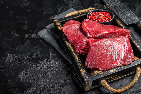 Uncooked Raw Venison dear meat, game meat. Black background. Top view ...