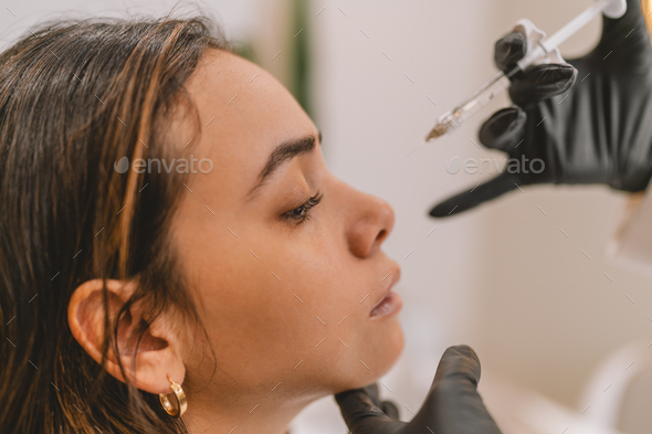 Woman about to receive a botox injection on the face Stock Photo by GSR ...