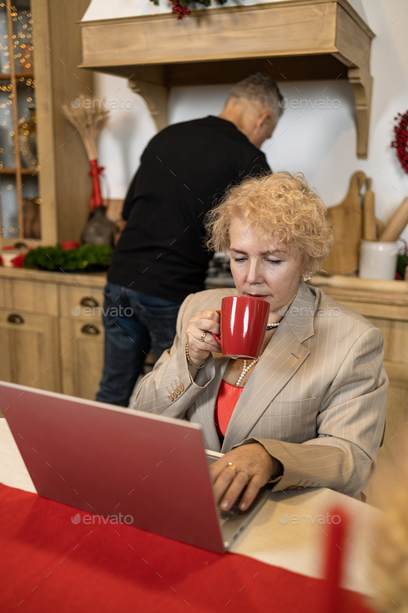 Mature mid aged 50s woman wife remote working or distance learning ...