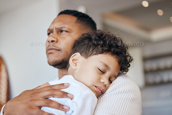Mixed race boy sleeping on his dads shoulder. Boy feeling safe in ...