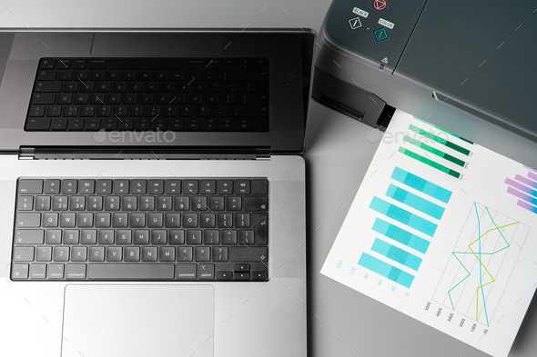Modern printer with paper and laptop on table in office Stock Photo by ...